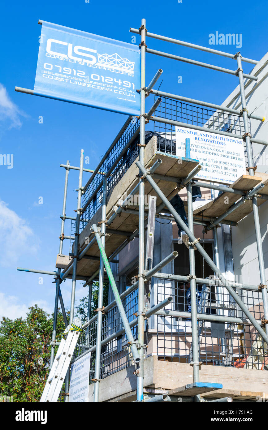 Scaffolding on windows hi-res stock photography and images - Alamy