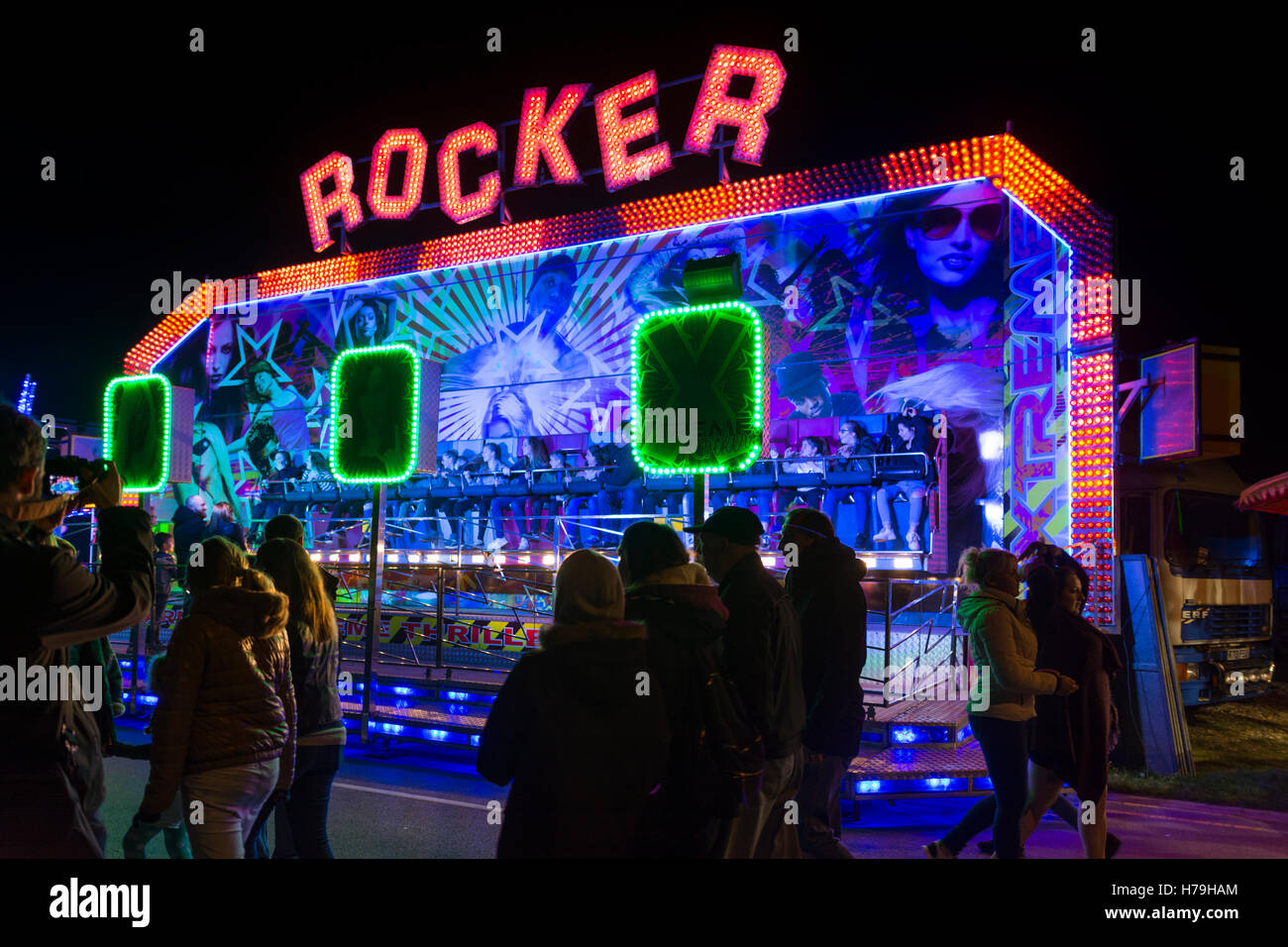 Rocker fairground ride at night and an outdoor event Stock Photo - Alamy