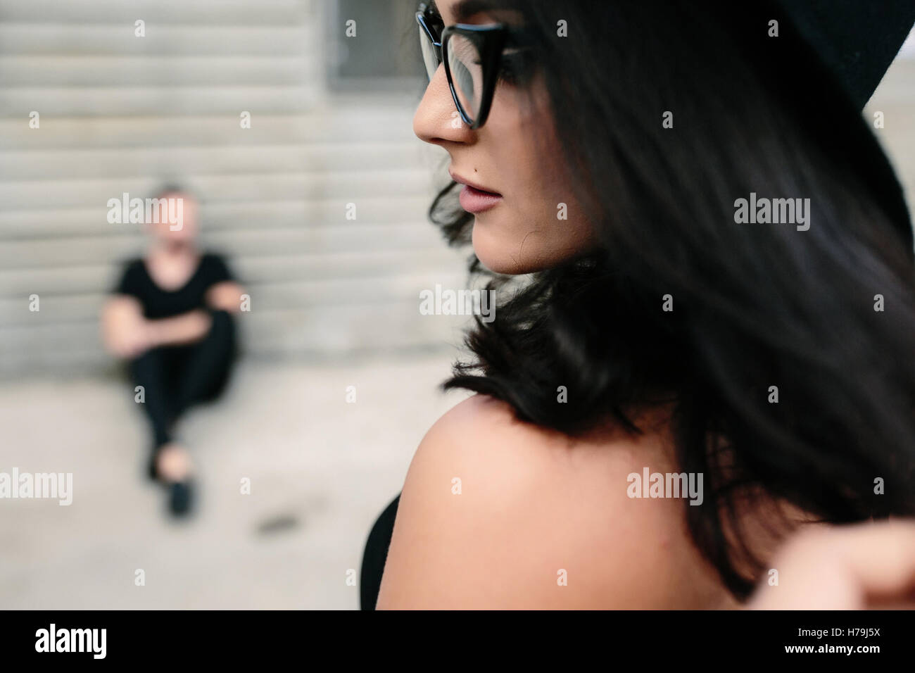 girl posing against background of a wall Stock Photo - Alamy