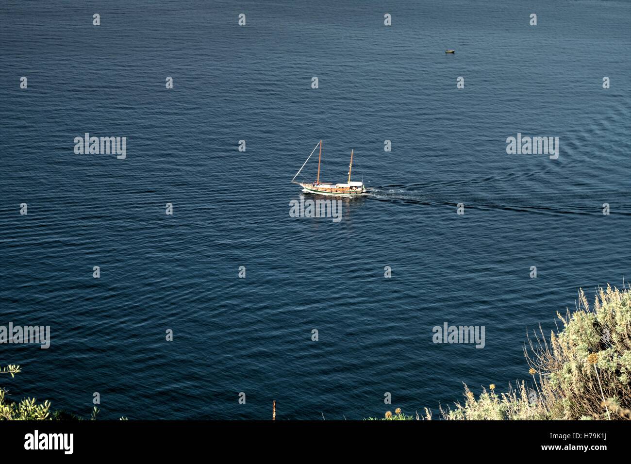 Small boat on calm sea hi-res stock photography and images - Alamy
