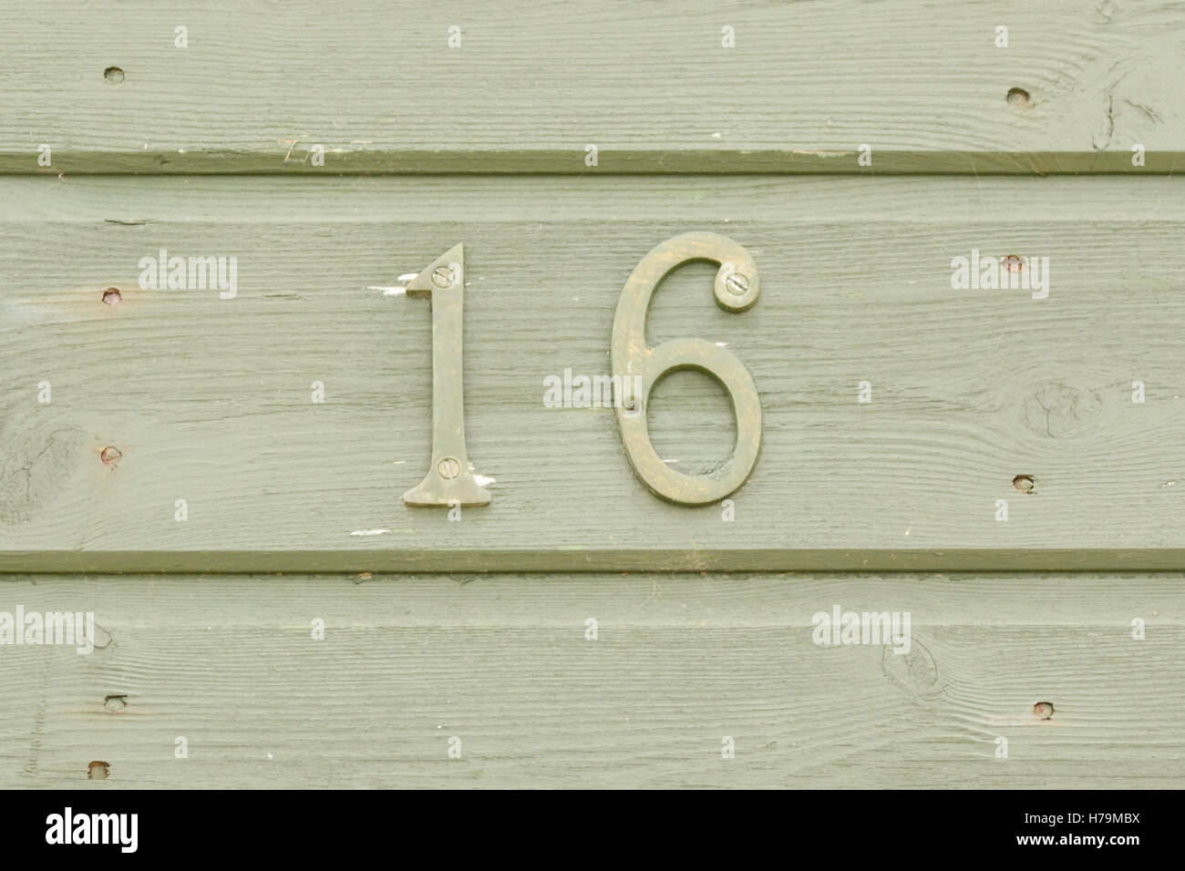 House Number 16 sign on door Stock Photo - Alamy