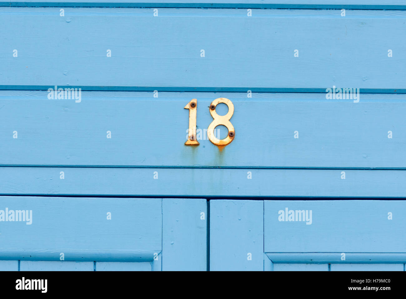 House Number 18 sign on door Stock Photo - Alamy