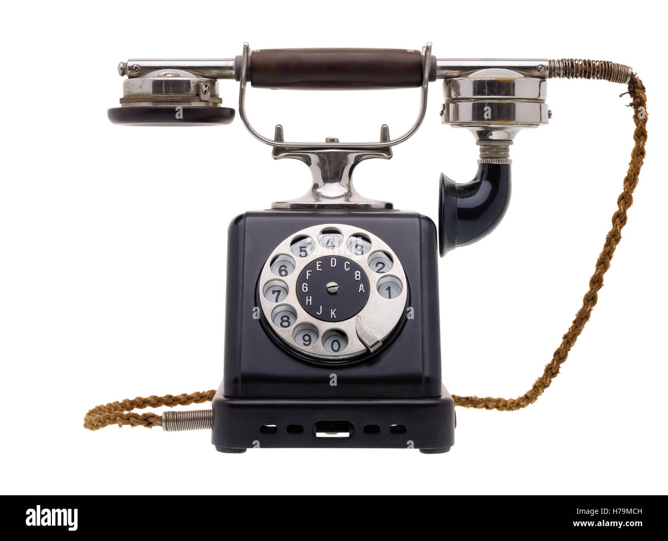 Isolated objects: one antique black telephone, very old and aged ...