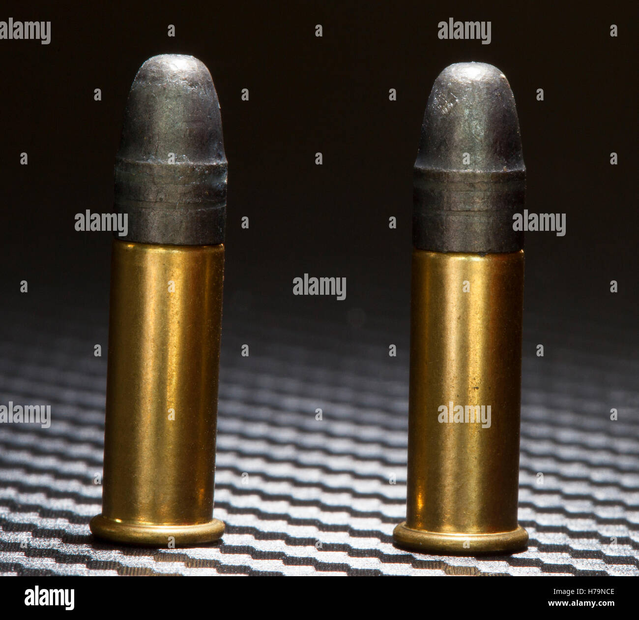Two cartridges that are for a twenty two rimfire firearm Stock Photo ...