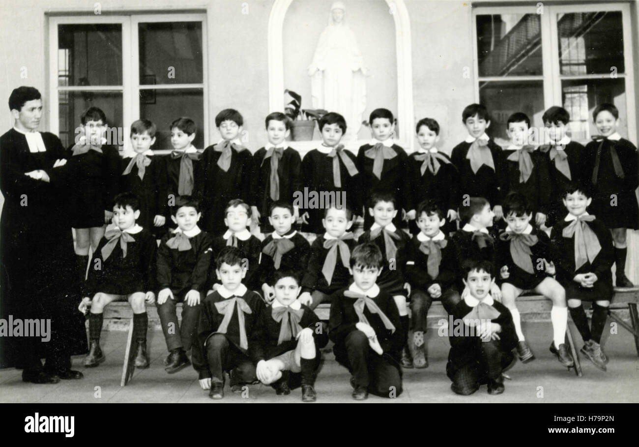 Class photo with the priests at school, Italy Stock Photo - Alamy