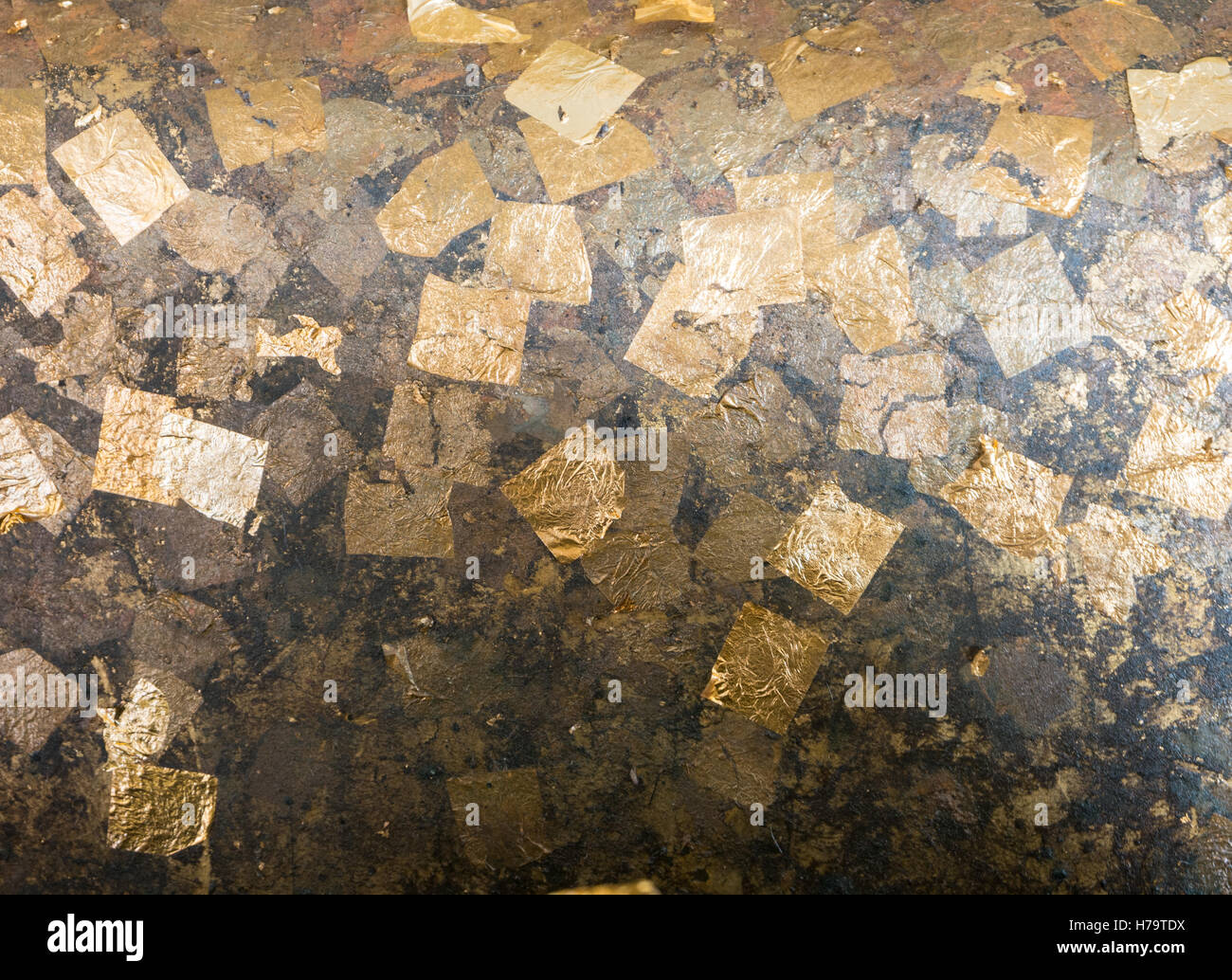 Texture of the gold leaf cover on buddha statue in temple, Thailand ...