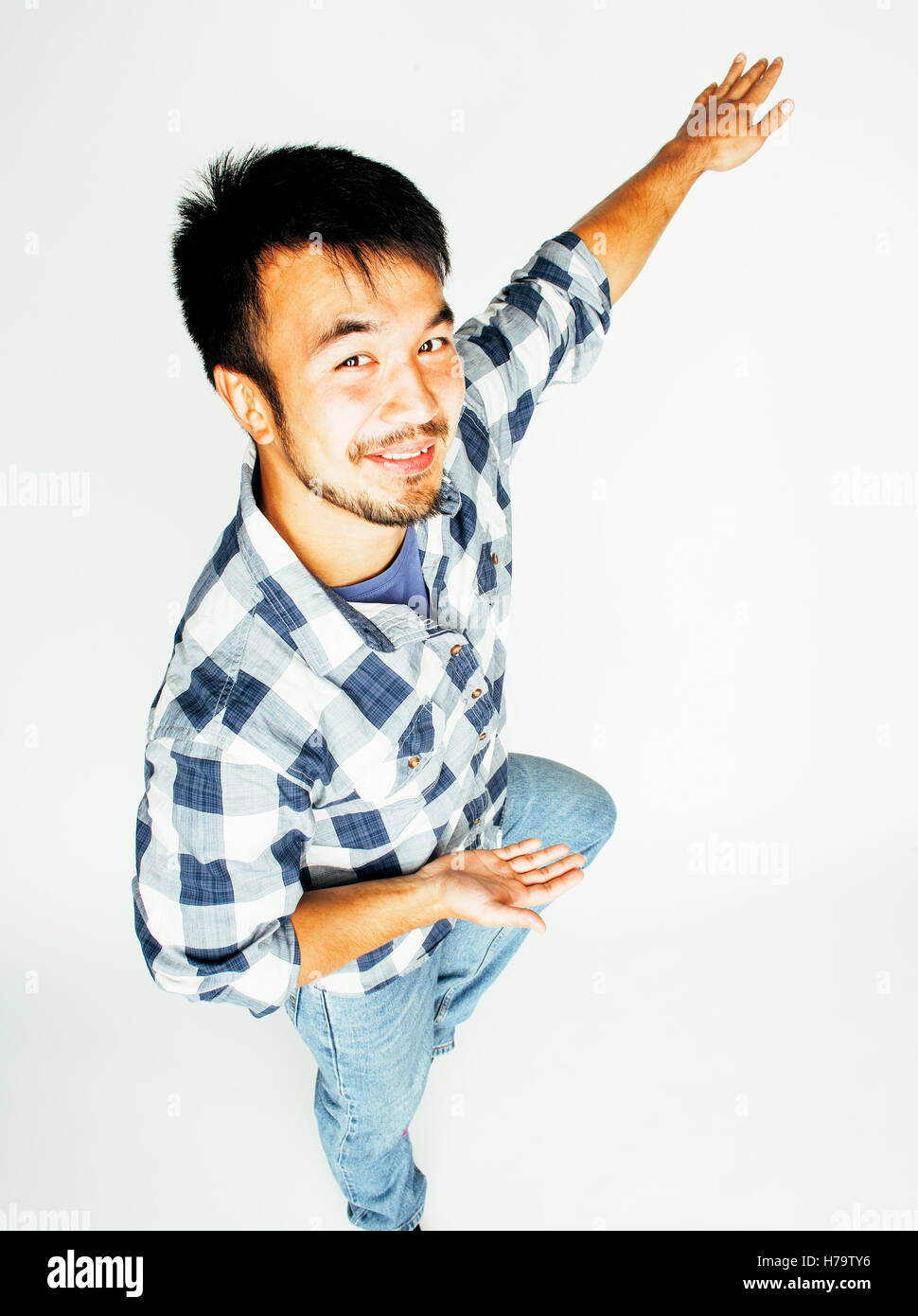 young pretty asian man jumping cheerful against white background ...