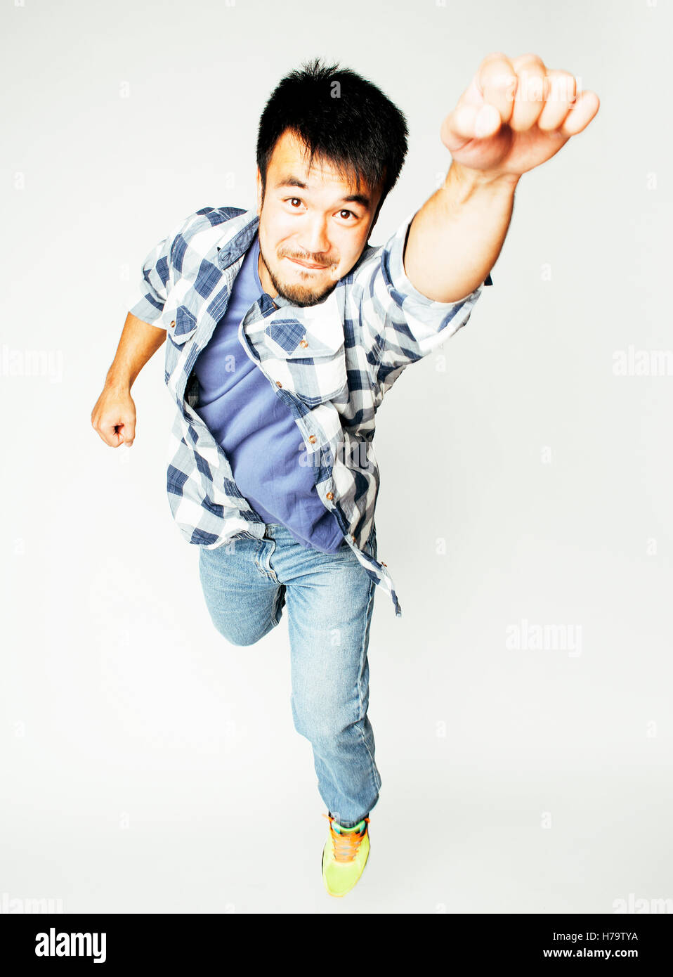 young pretty asian man jumping cheerful against white background ...