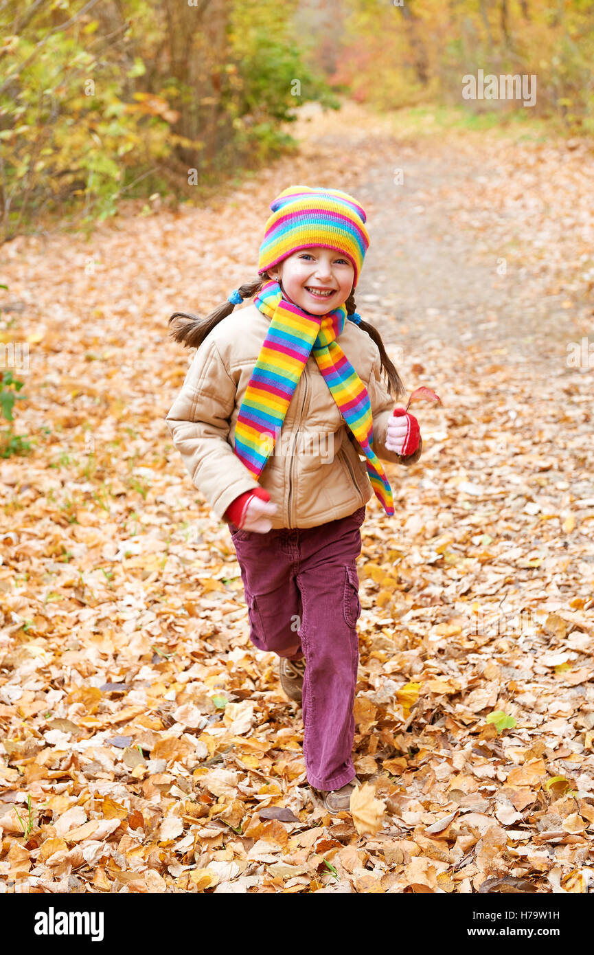 girl child run in autumn forest Stock Photo - Alamy
