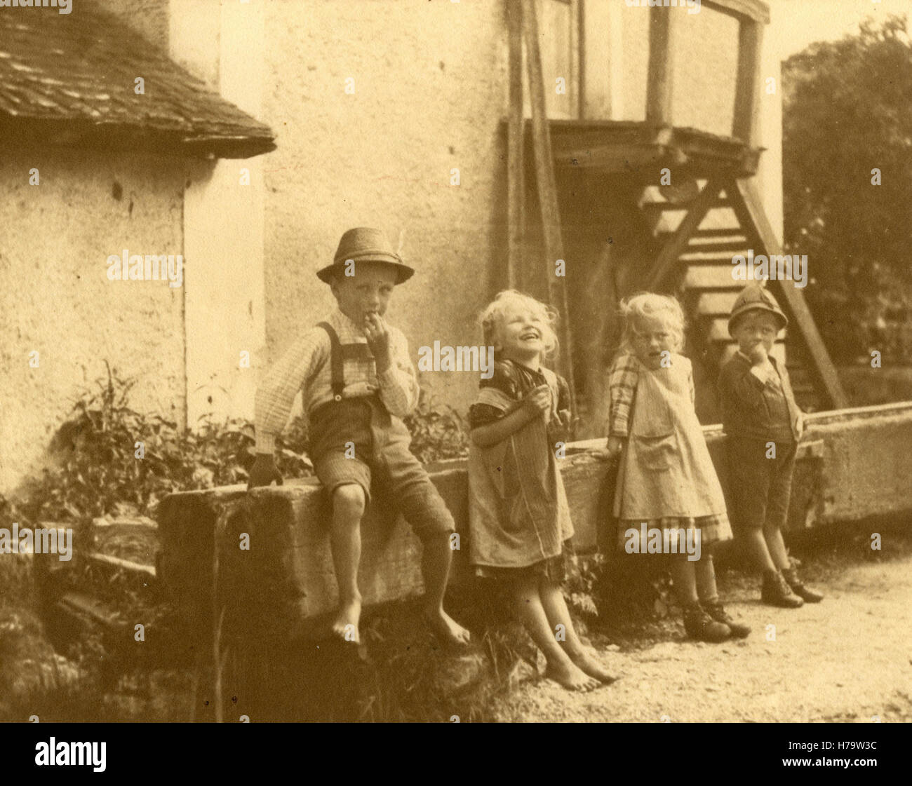 Four children playing outside, Denmark Stock Photo - Alamy