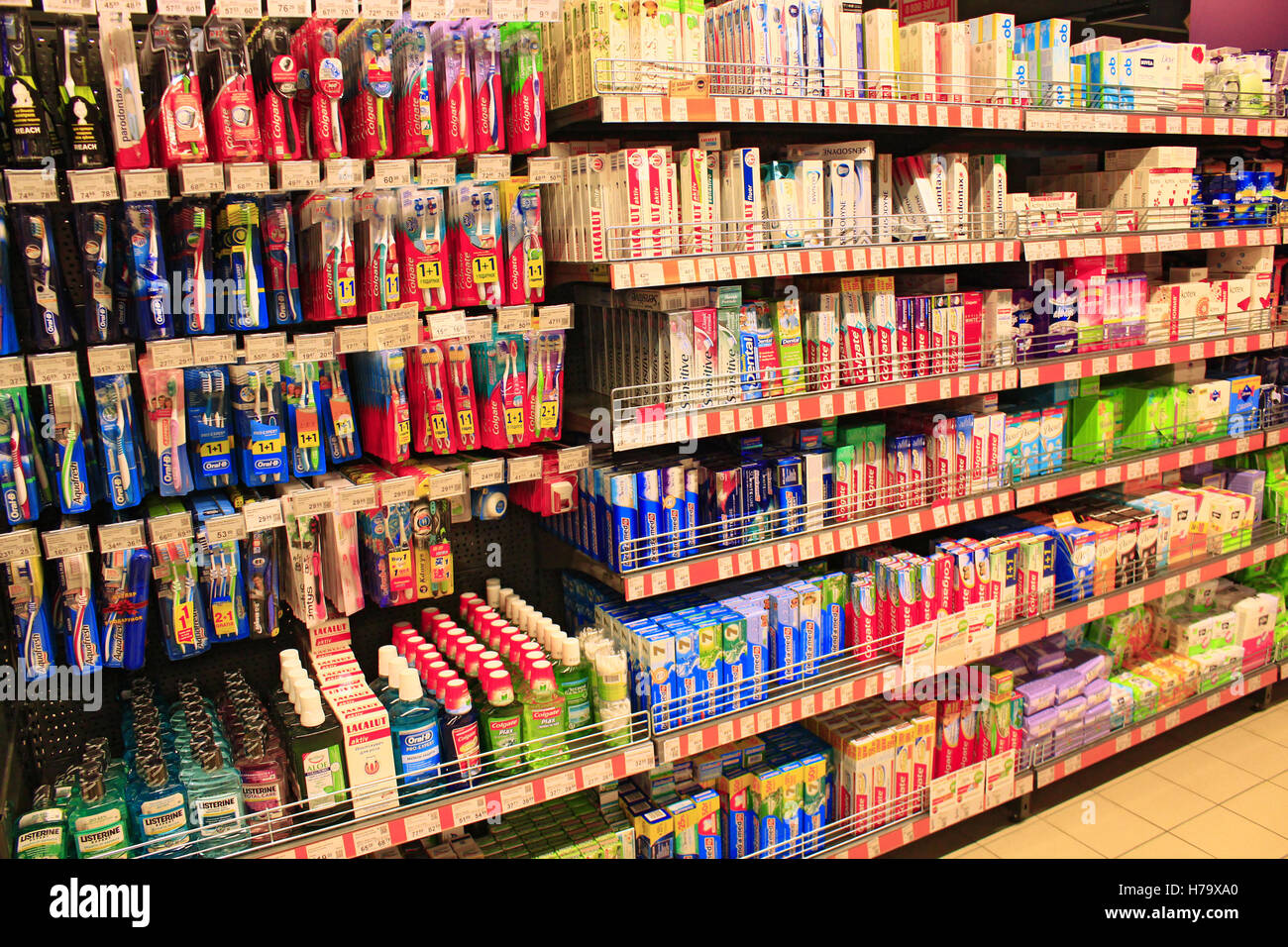 different kinds of toothpaste and brushes and other hygiene products ...