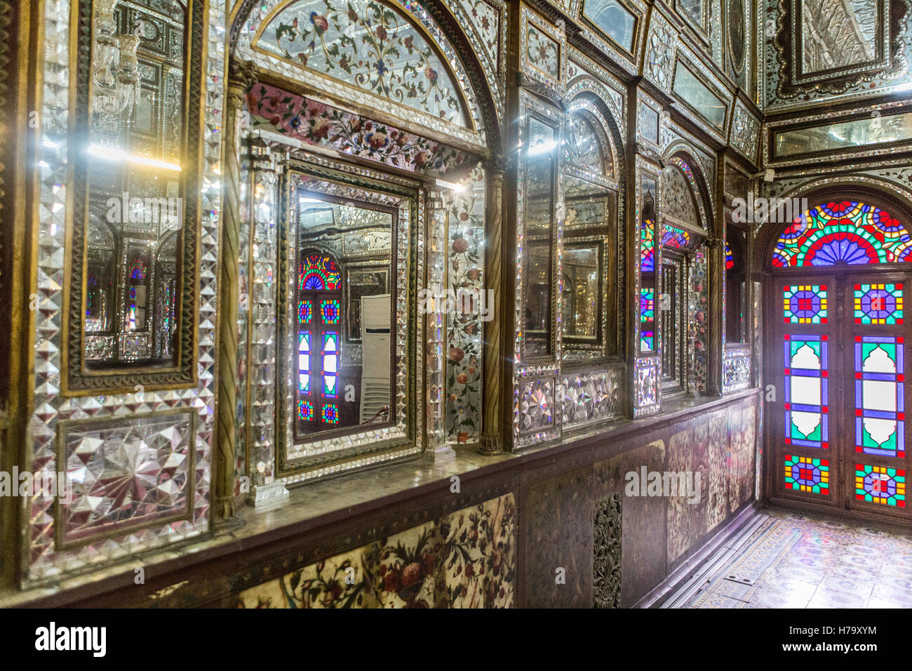 mirrored room with stained glass door Stock Photo - Alamy