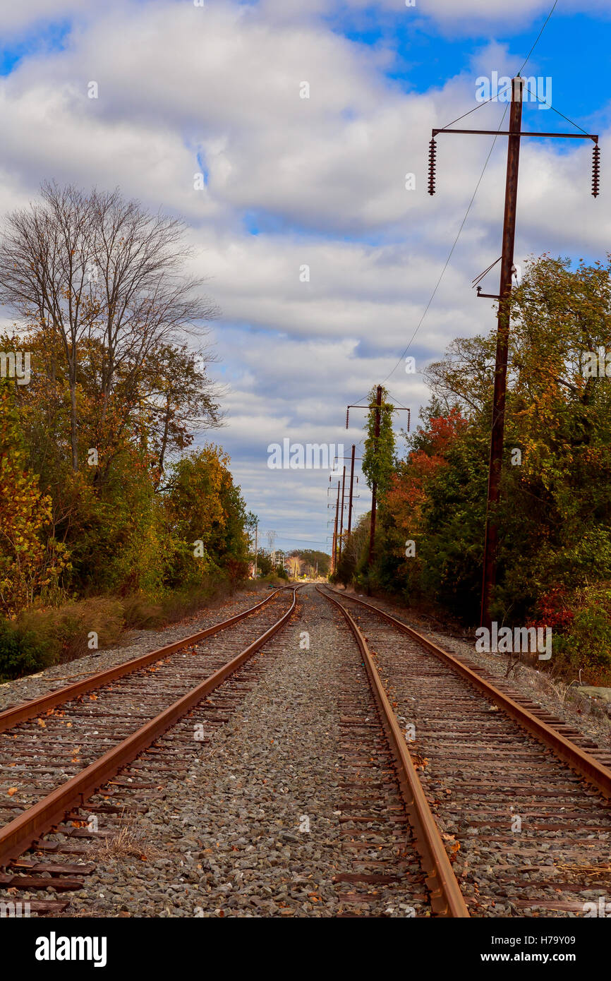 Railroad blue sky and cloudy sky clouds railroad Stock Photo - Alamy