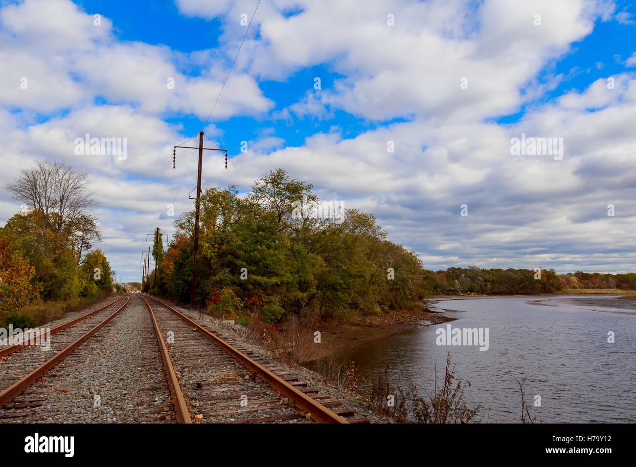 railroad close up to horizon under dramatic sky sky clouds railroad ...