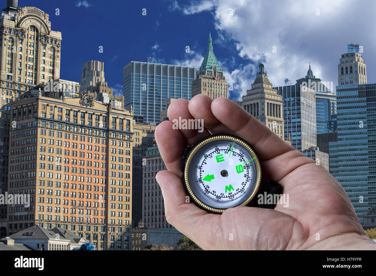 Navigating in New York City with a compass in hand Stock Photo - Alamy