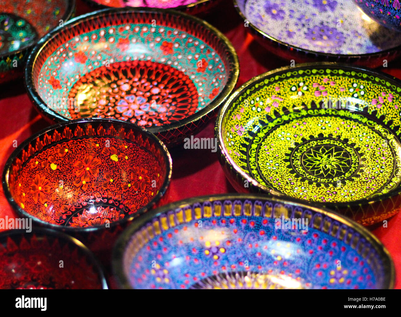 Intricately painted lacquer bowls at a Thai market in Thailand. Bright ...