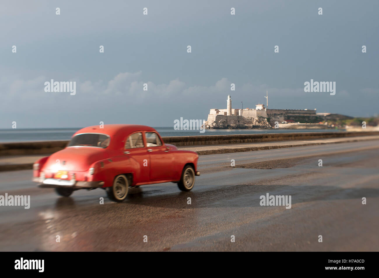 Dreamy tilt-shift scenic view of vintage American car taxi driving in ...