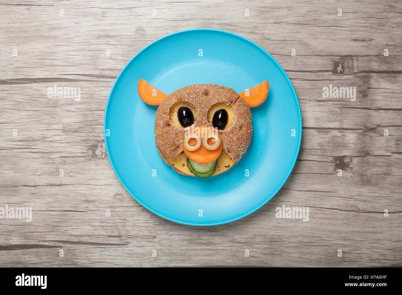 Pig made of bread and vegetables on board and plate Stock Photo - Alamy
