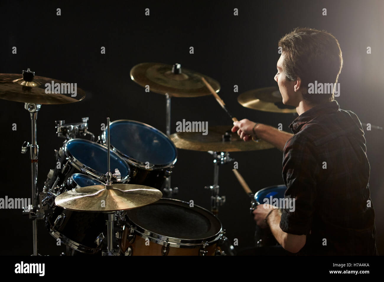 Rear View Of Drummer Playing Drum Kit In Studio Stock Photo - Alamy