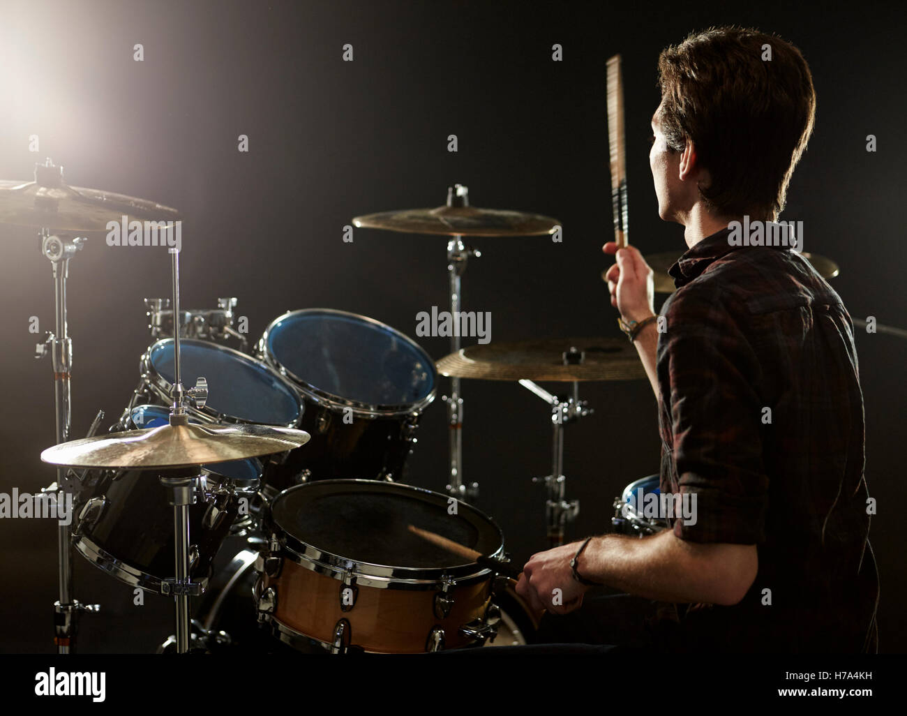 Rear View Of Drummer Playing Drum Kit In Studio Stock Photo - Alamy