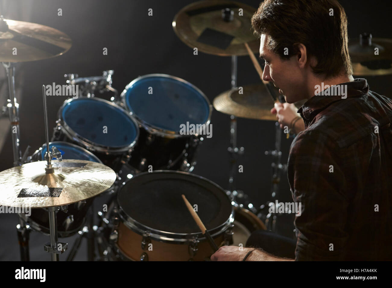 Rear View Of Drummer Playing Drum Kit In Studio Stock Photo - Alamy