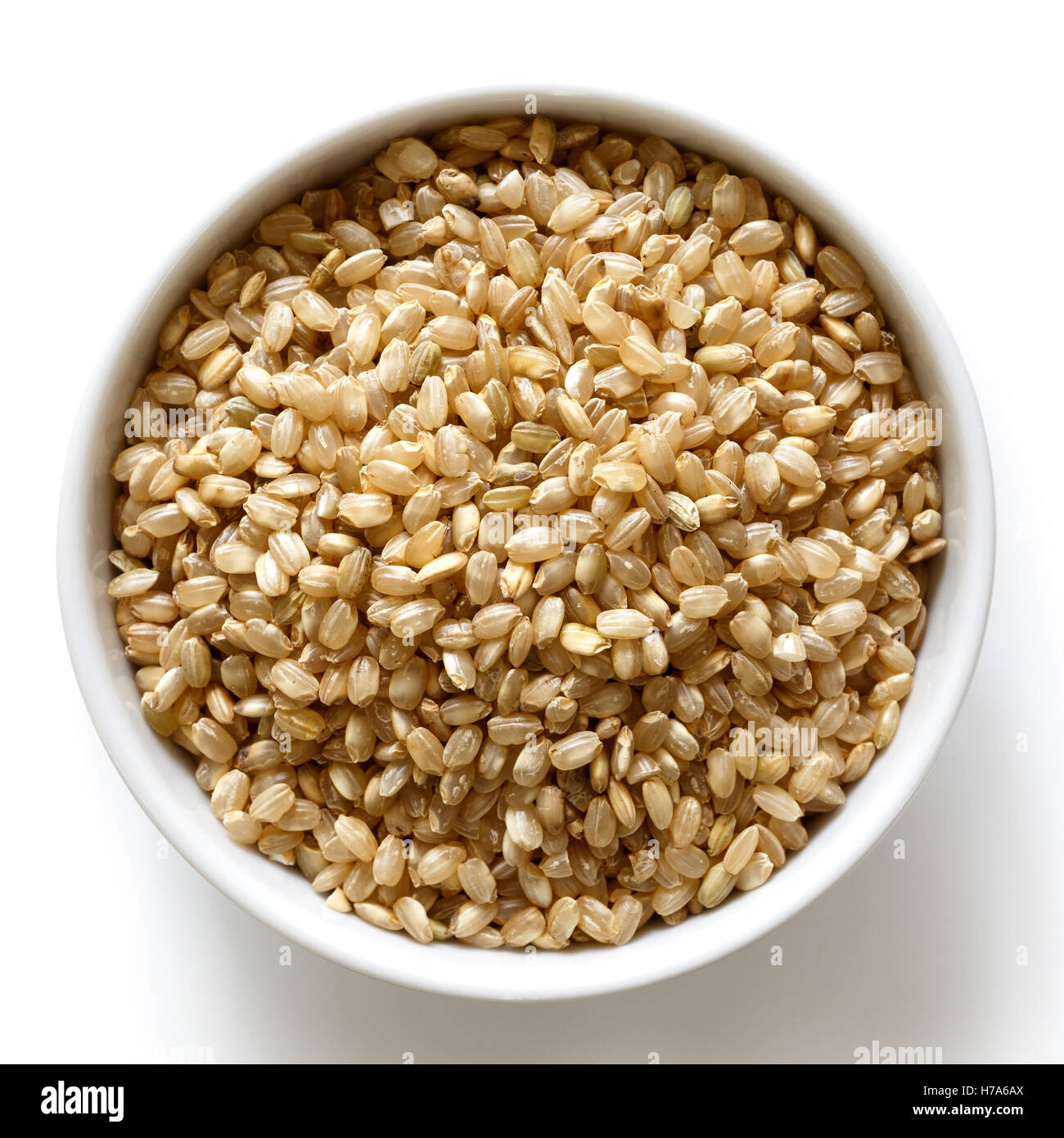Bowl of short grain brown rice isolated on white from above Stock Photo ...