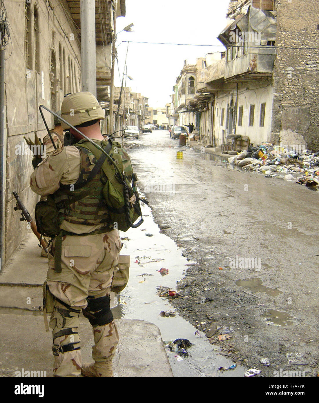 22nd November 2004 A U.S. Army soldier uses his rifle sight to check ...