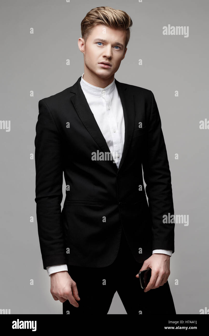 Portrait of a young handsome business man Stock Photo - Alamy