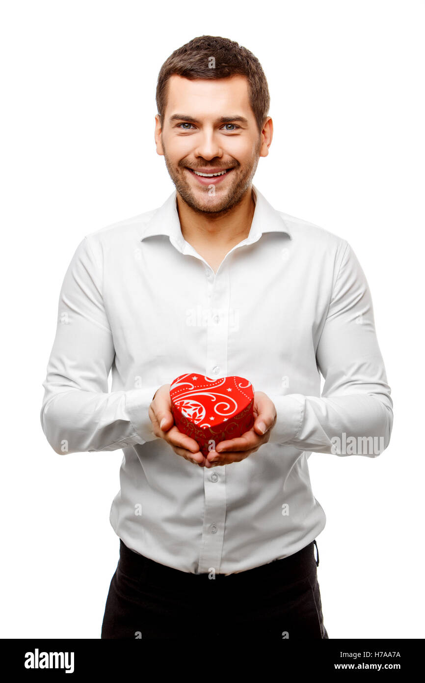 Young man carries heart shaped box Stock Photo - Alamy