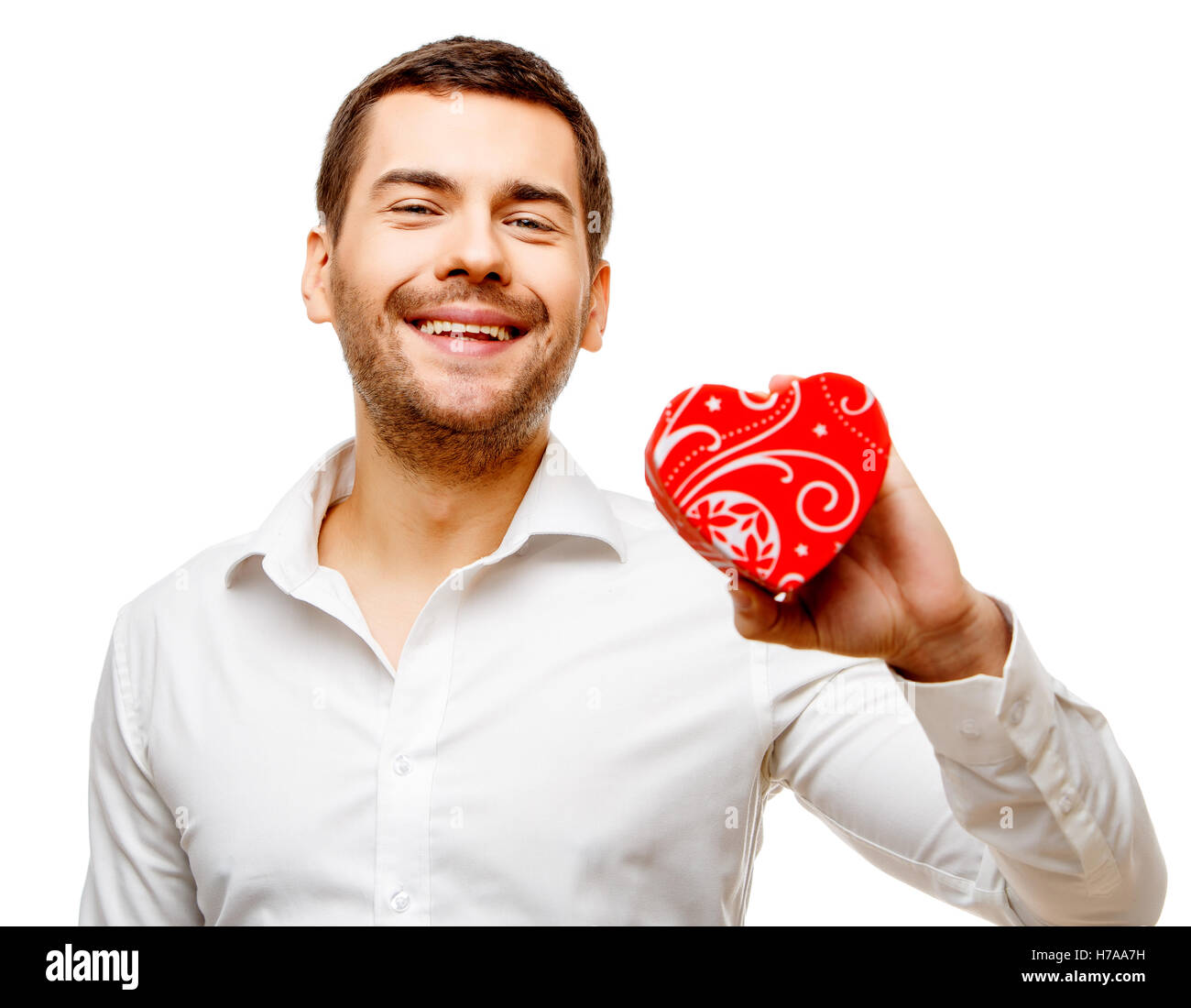 Young man carries heart shaped box Stock Photo - Alamy