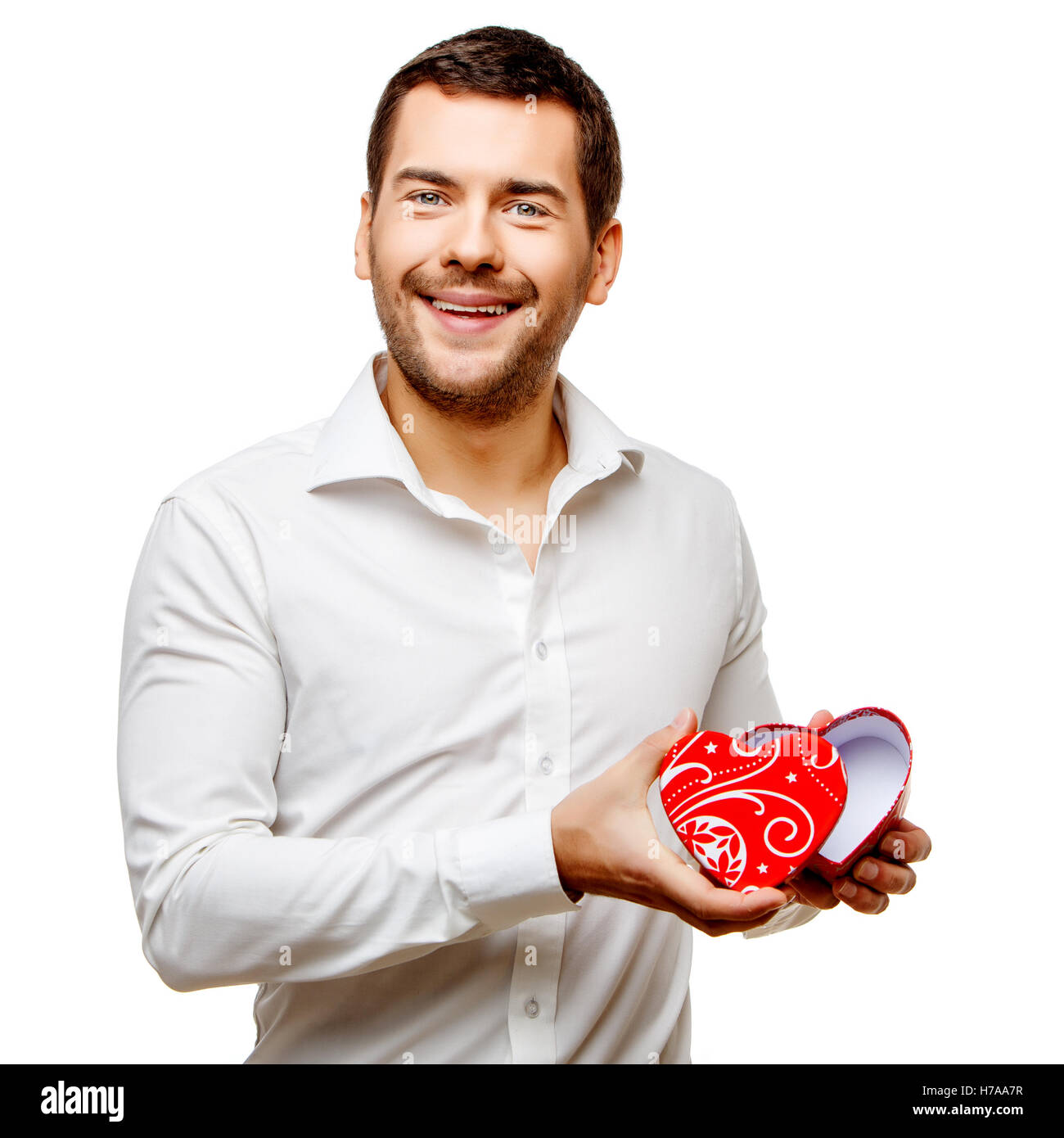 Young man carries heart shaped box Stock Photo - Alamy