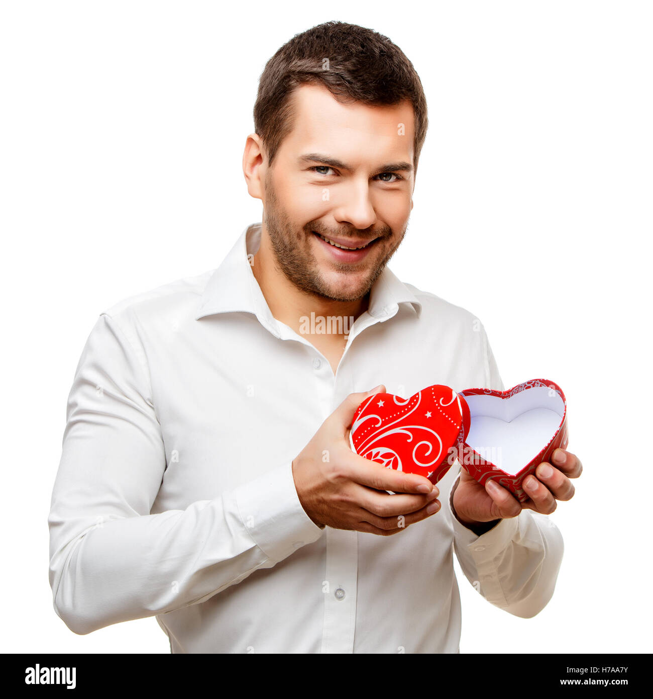 Young man carries heart shaped box Stock Photo - Alamy