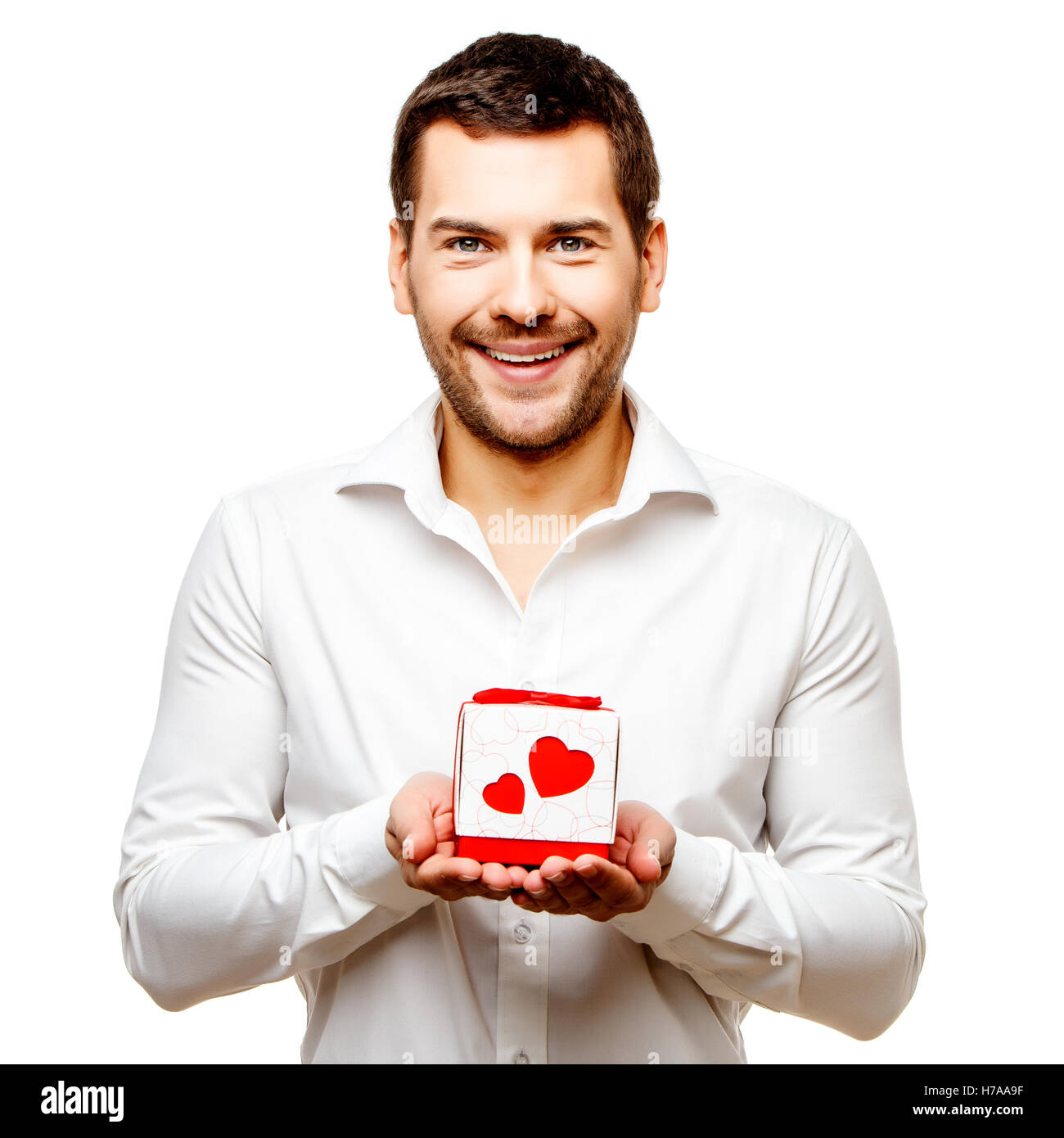 Young man carries heart shaped box Stock Photo - Alamy