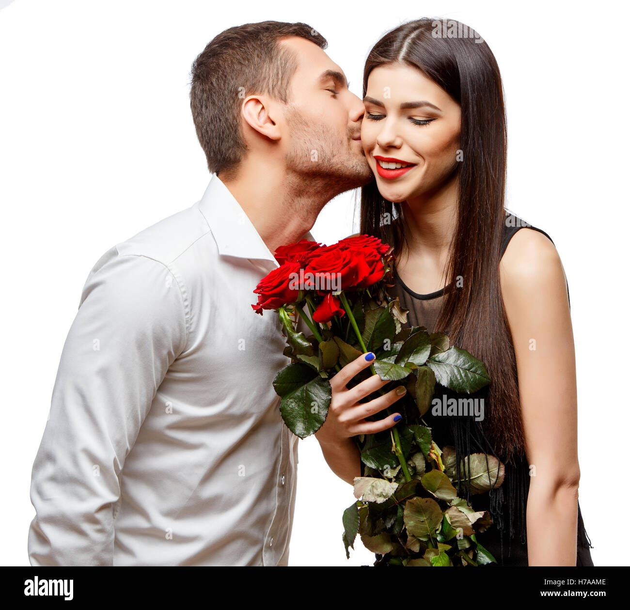 Young beautiful couple with flowers isolated on white Stock Photo - Alamy