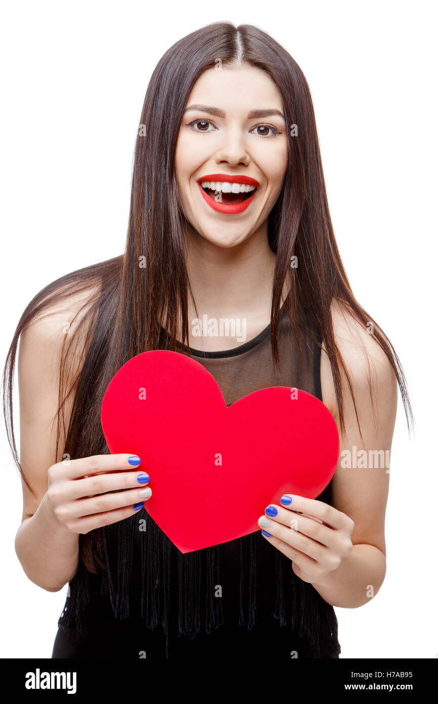 Beautiful woman holding heart shaped valentine card and smiling Stock ... Beautiful woman holding heart shaped valentine card and smiling Stock ...