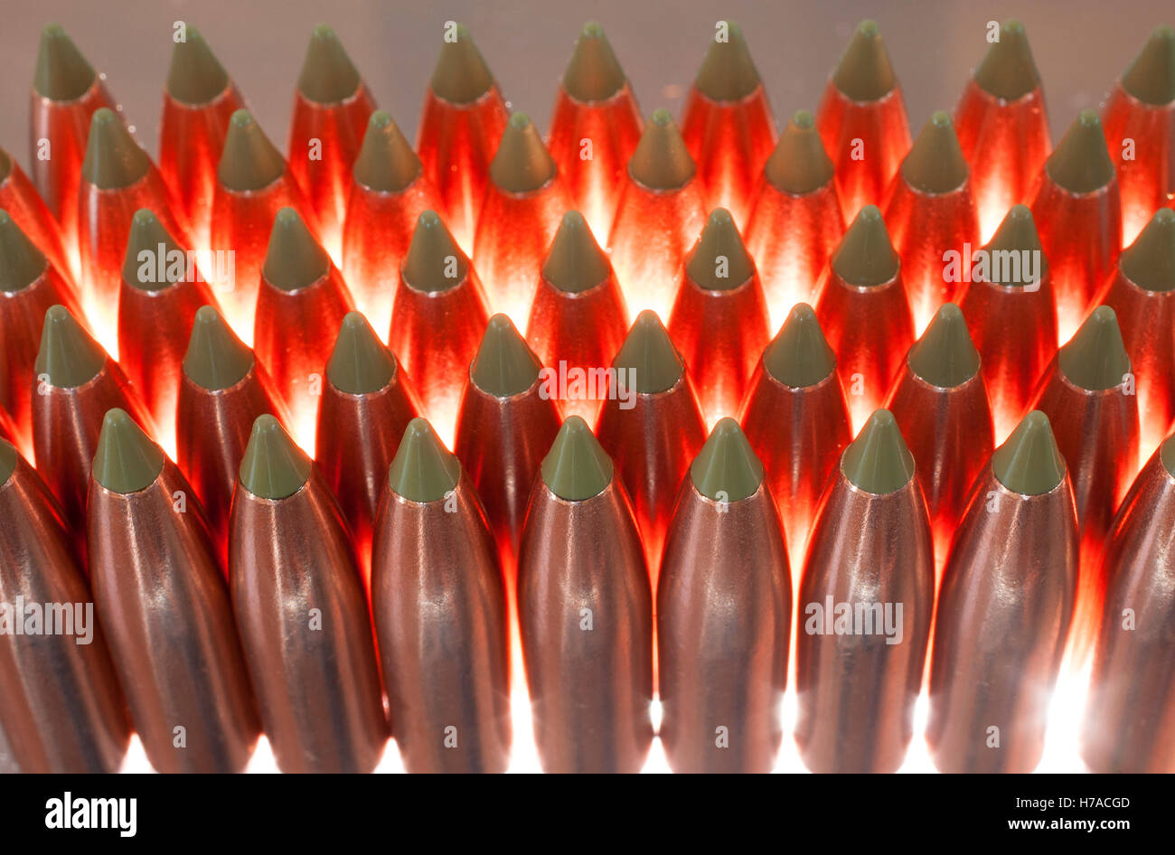 Copper plated bullets with light coming from underneath Stock Photo - Alamy