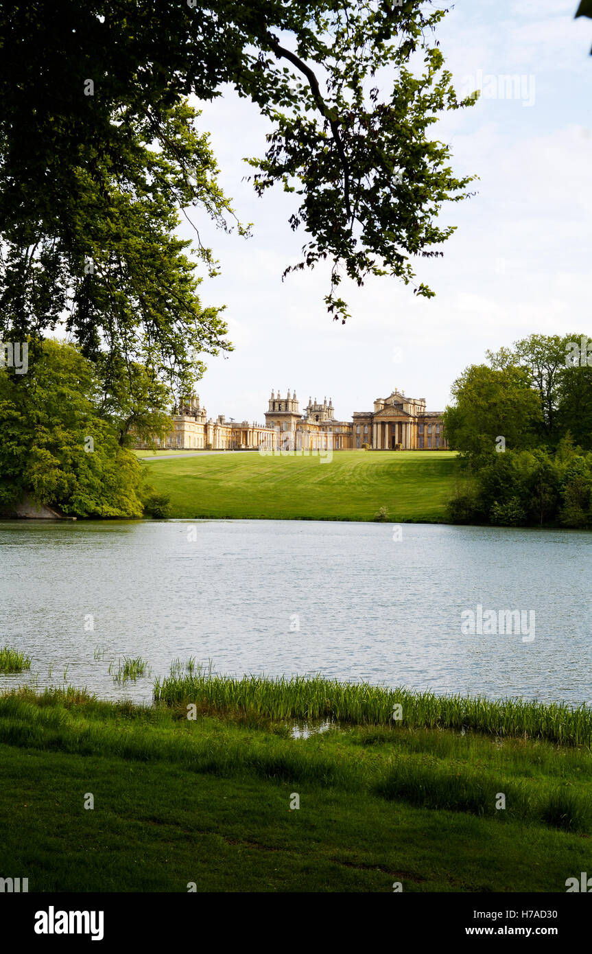 Baroque facade of Blenheim Palace viewed across river Glyme ...