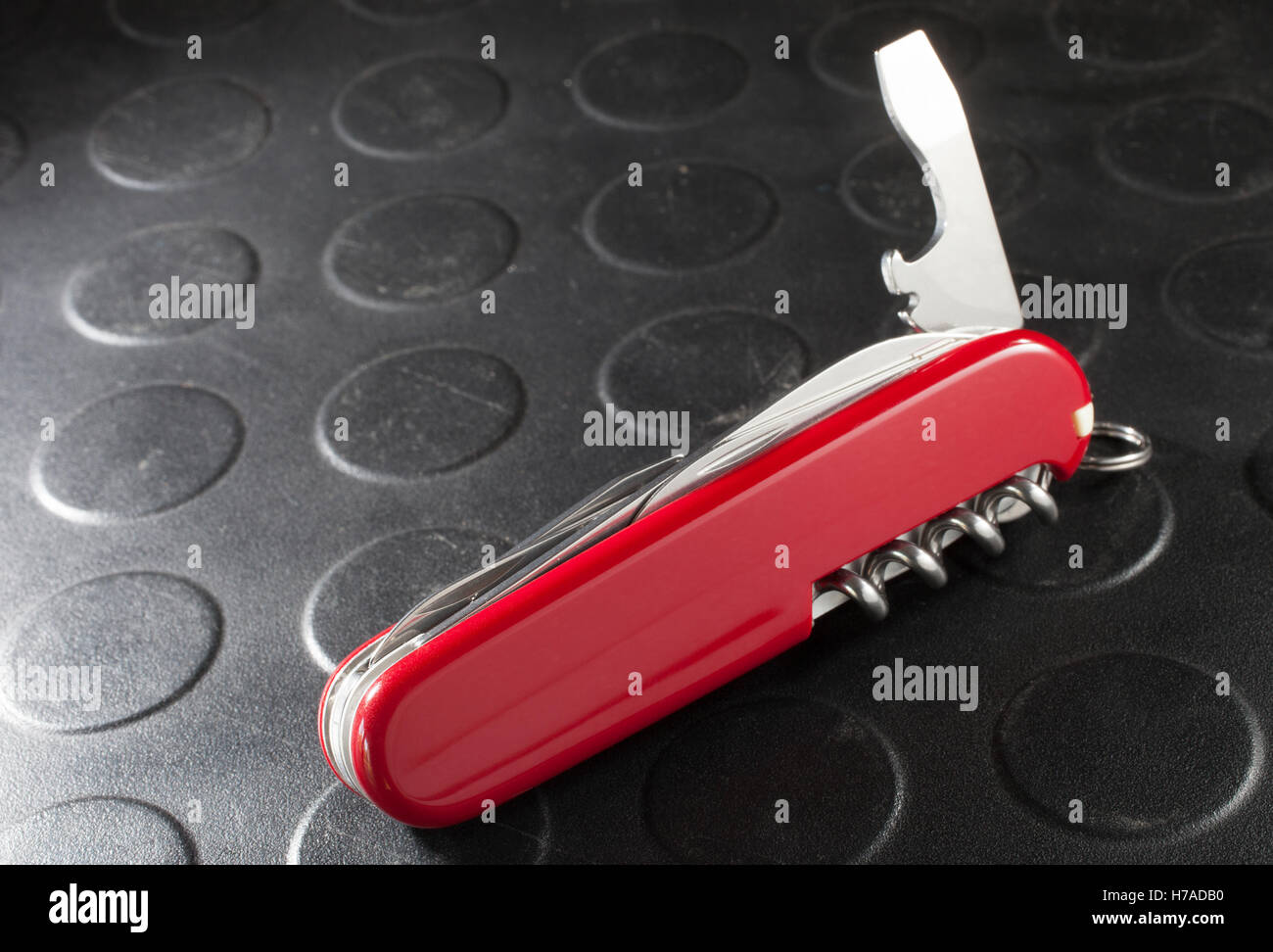 Blade that functions on a bottle opener on a pocket knife Stock Photo ...