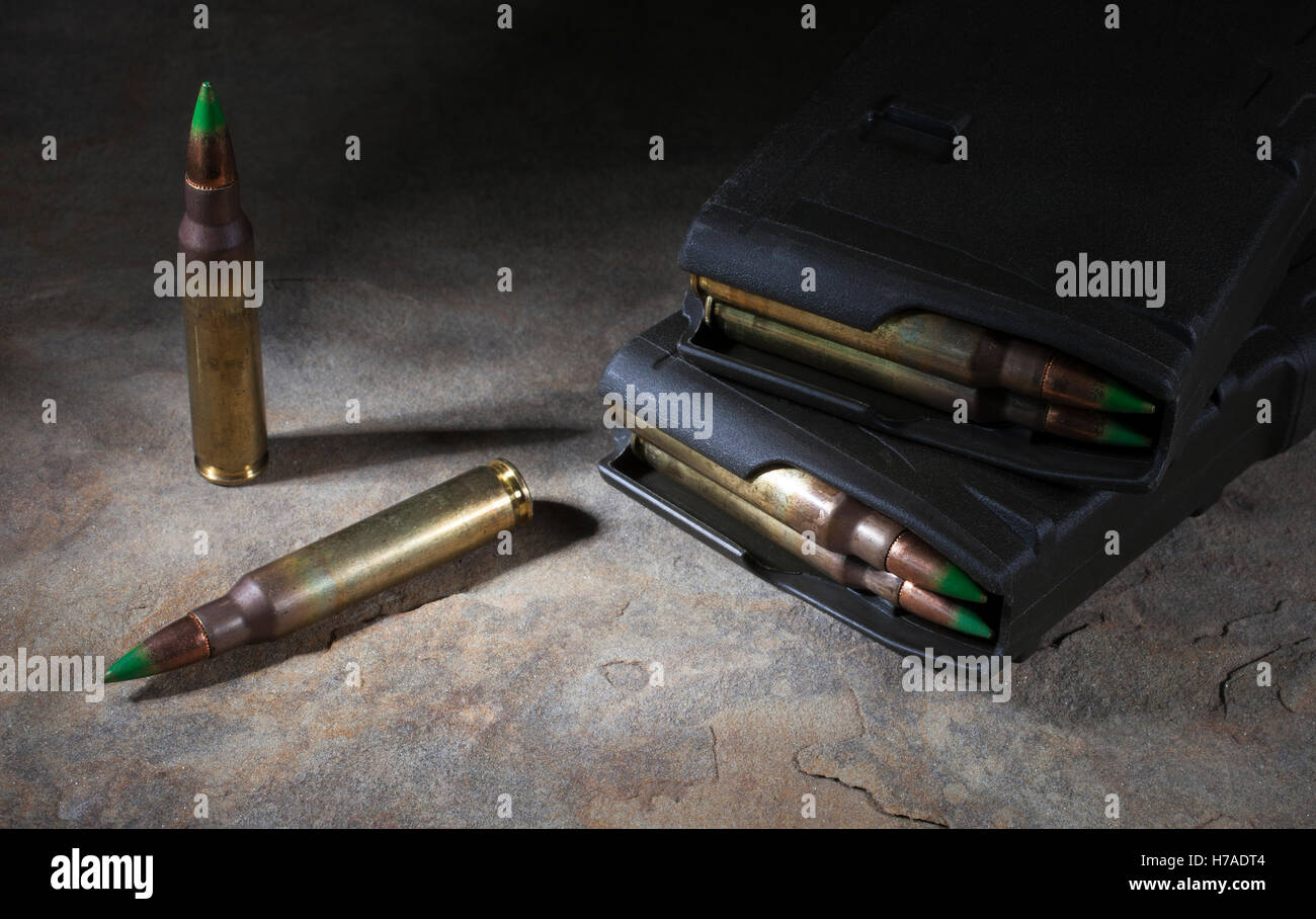 Green tipped bullets and thirty round magazines for a modern sporting ...