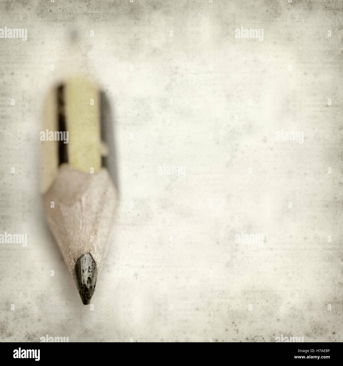 textured old paper background with very short pencil sharpened at both ...