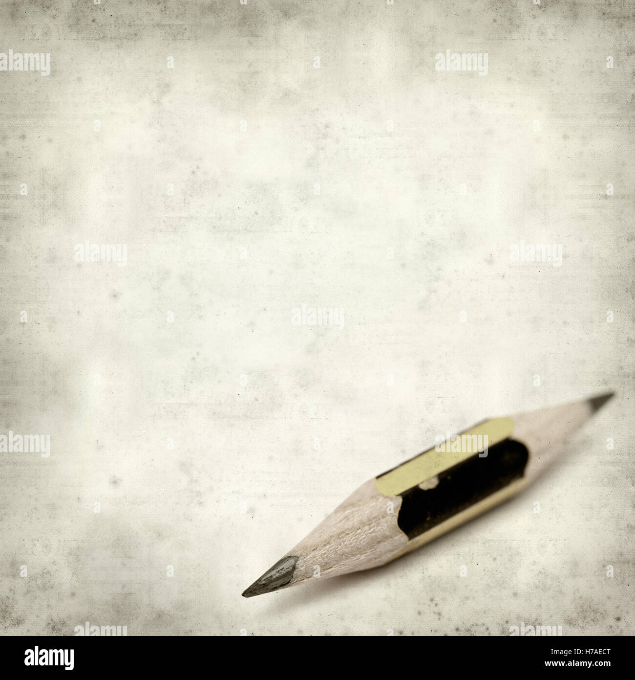 textured old paper background with very short pencil sharpened at both ...