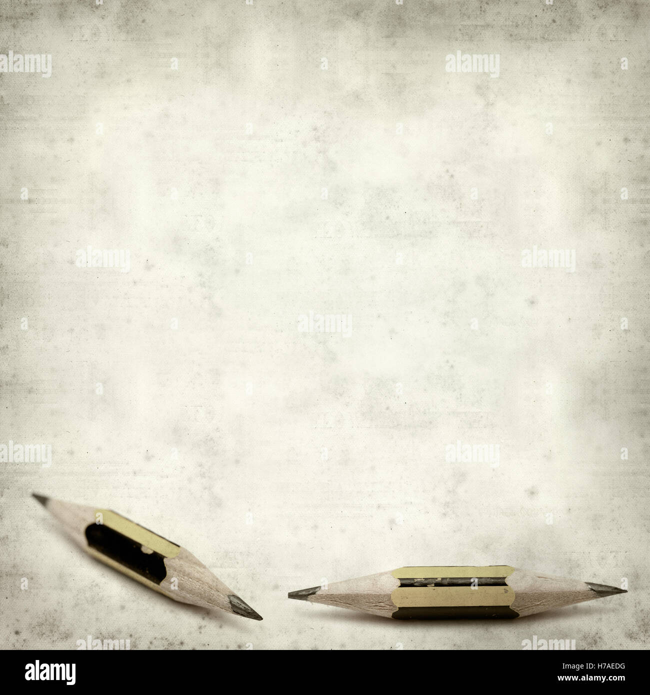 textured old paper background with very short pencil sharpened at both ...