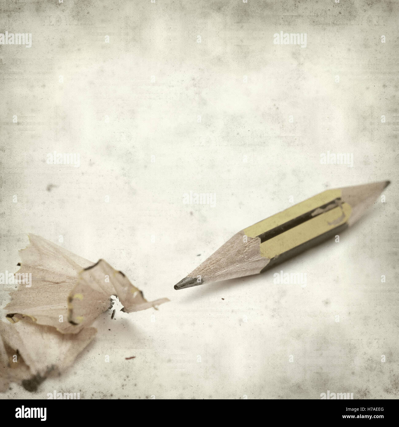 textured old paper background with very short pencil sharpened at both ...
