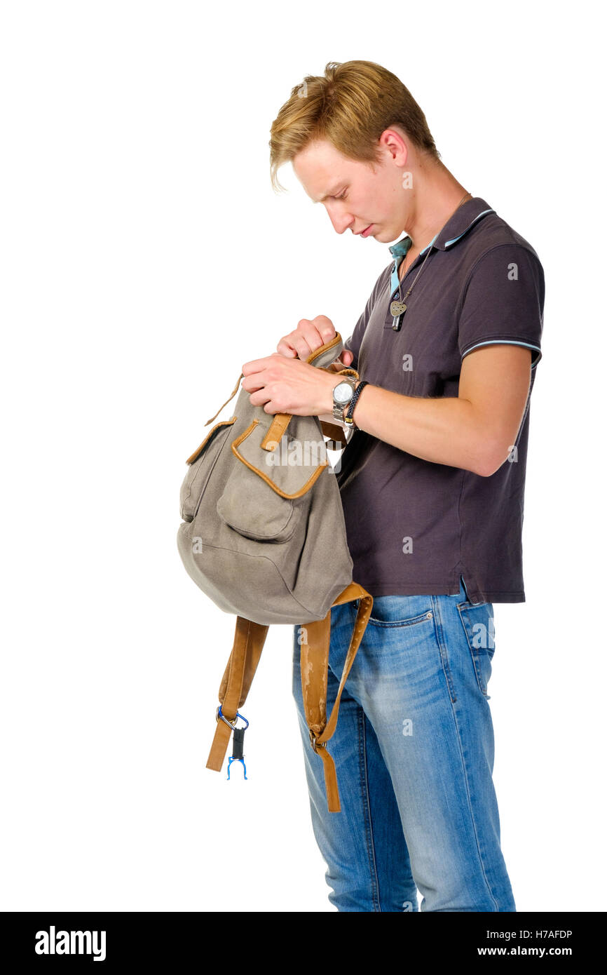 Young happy looking for something inside backpack Stock Photo - Alamy