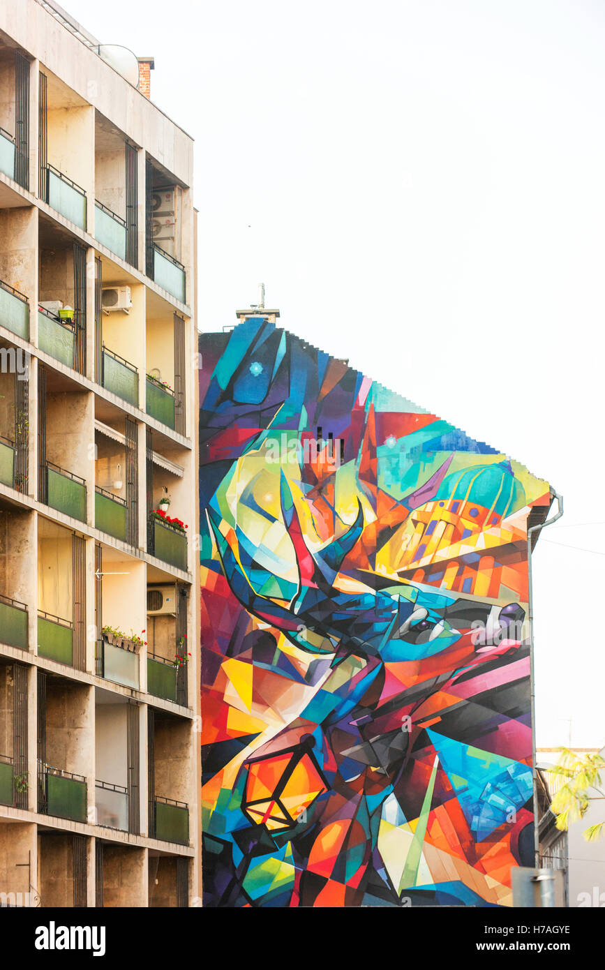 Colourful mural on a building beside an apartment building Stock Photo ...