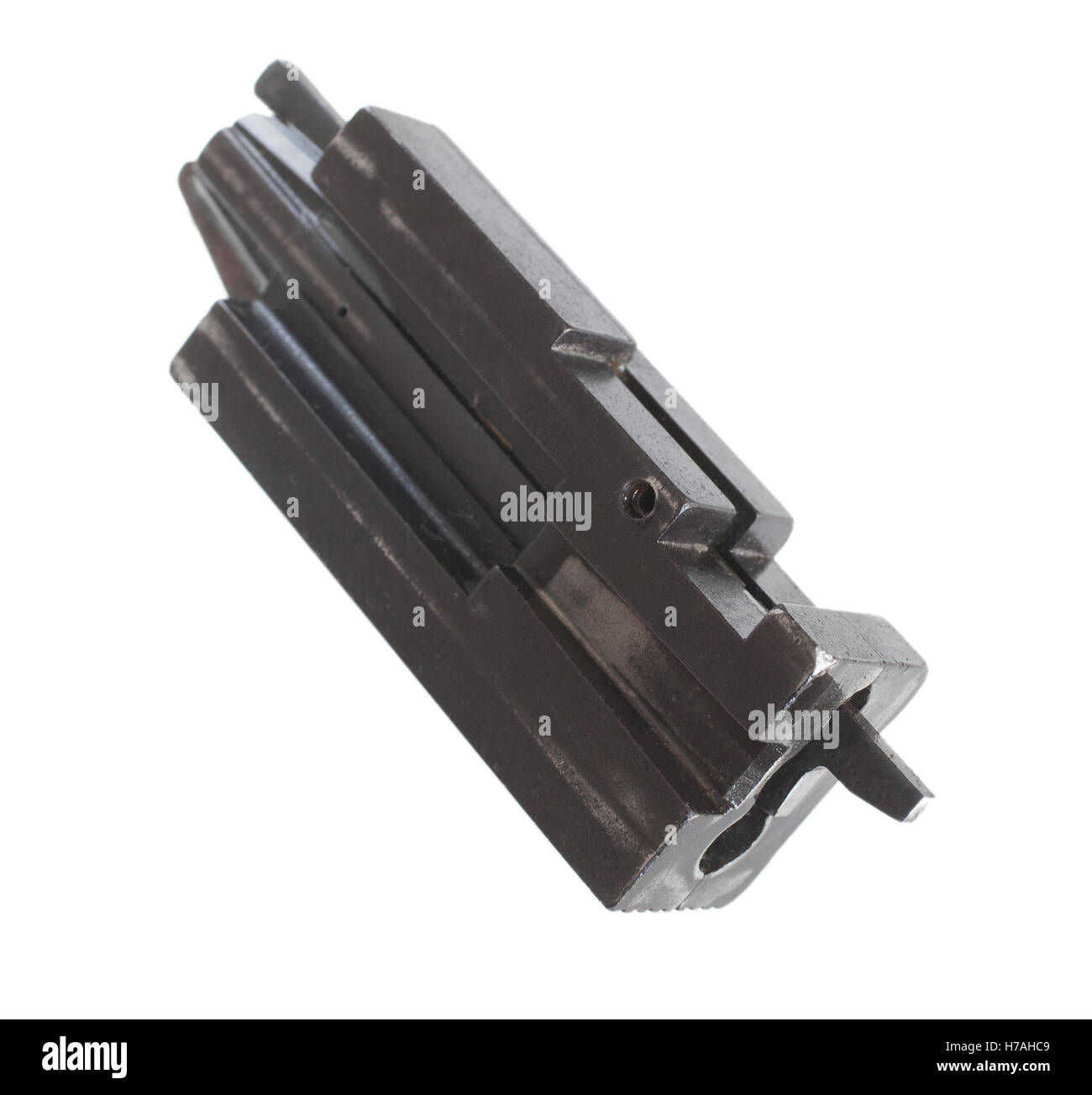 Machine part that carries the firing pin and extractor on a gun ...