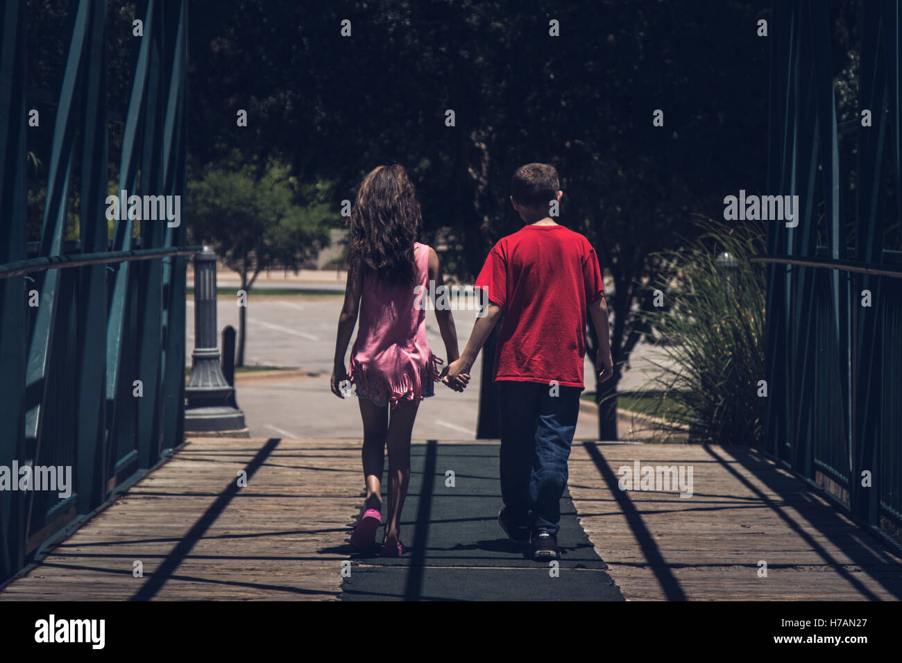 Holding hands across the hi-res stock photography and images - Alamy