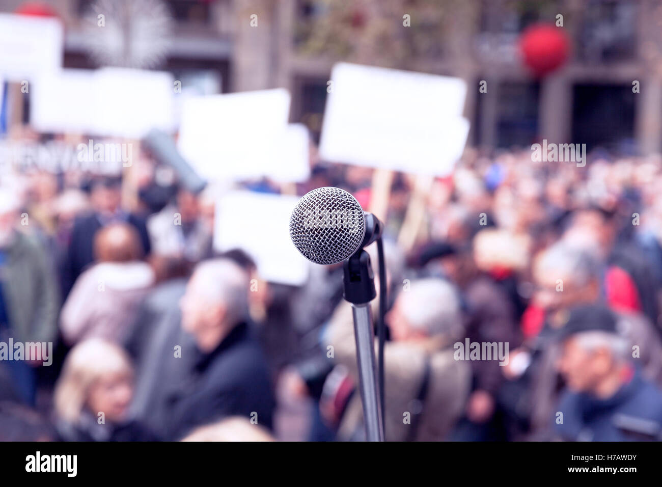 Microphone in focus against blurred protesters Stock Photo - Alamy