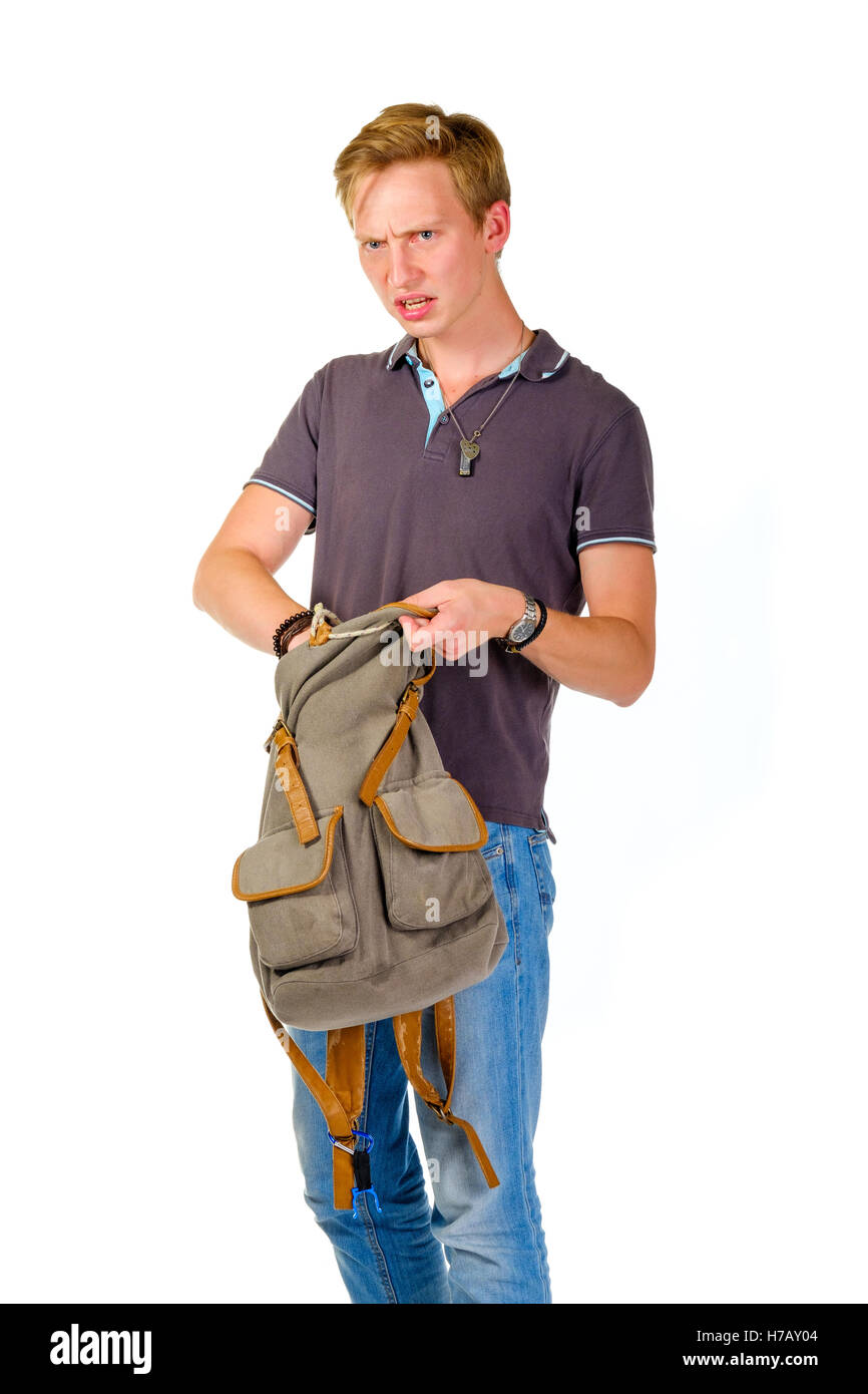 Young man looking for something inside his backpack Stock Photo - Alamy