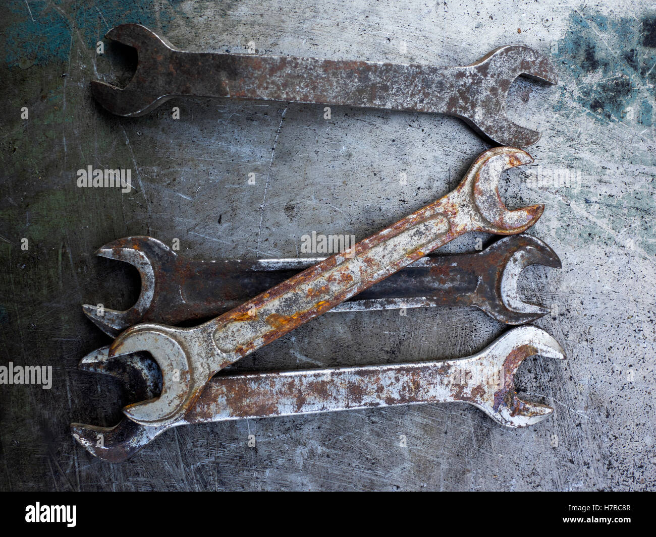 Old rusty wrench on metal background Stock Photo - Alamy